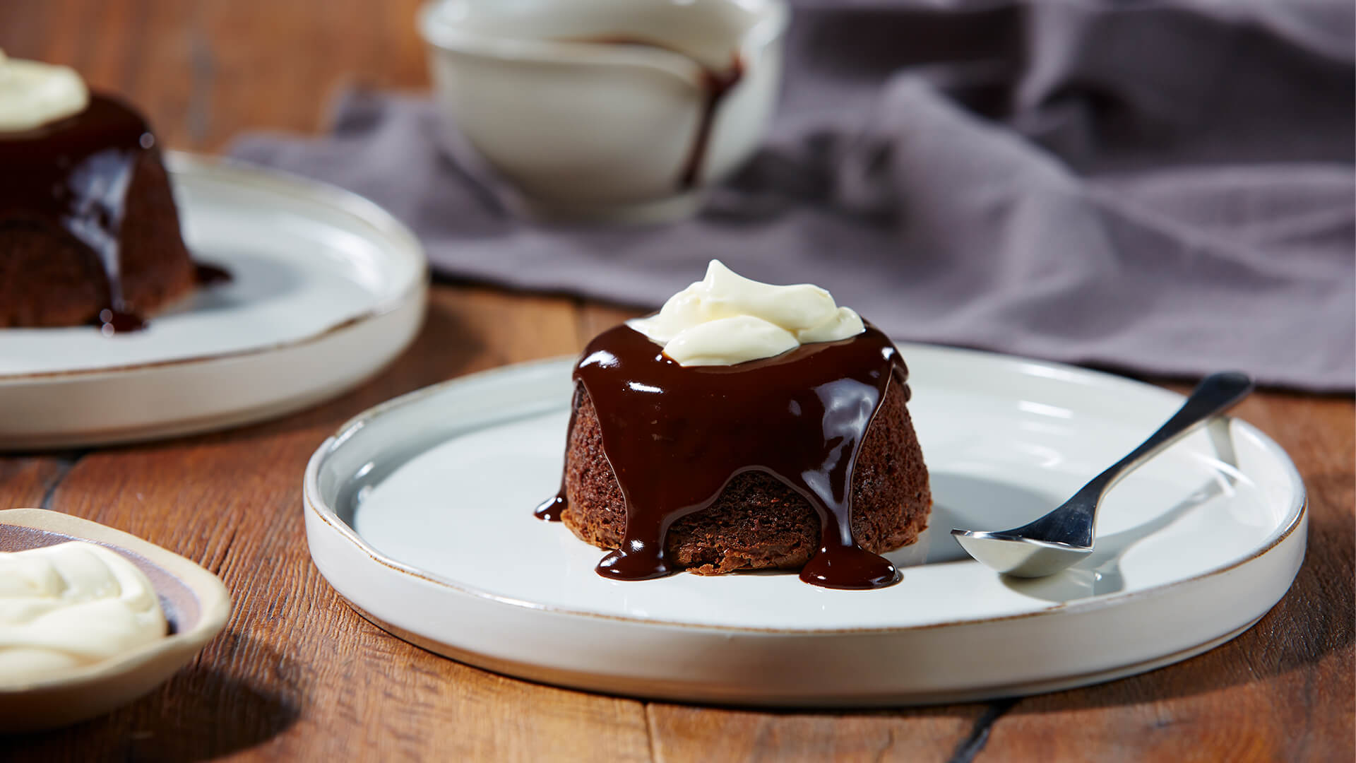 decadent rum 'n' raisin chocolate puddings with chocolate sauce | Bulla ...